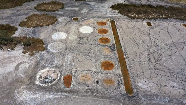As the waters receded, the 2,000-year-old salt field came to light ...